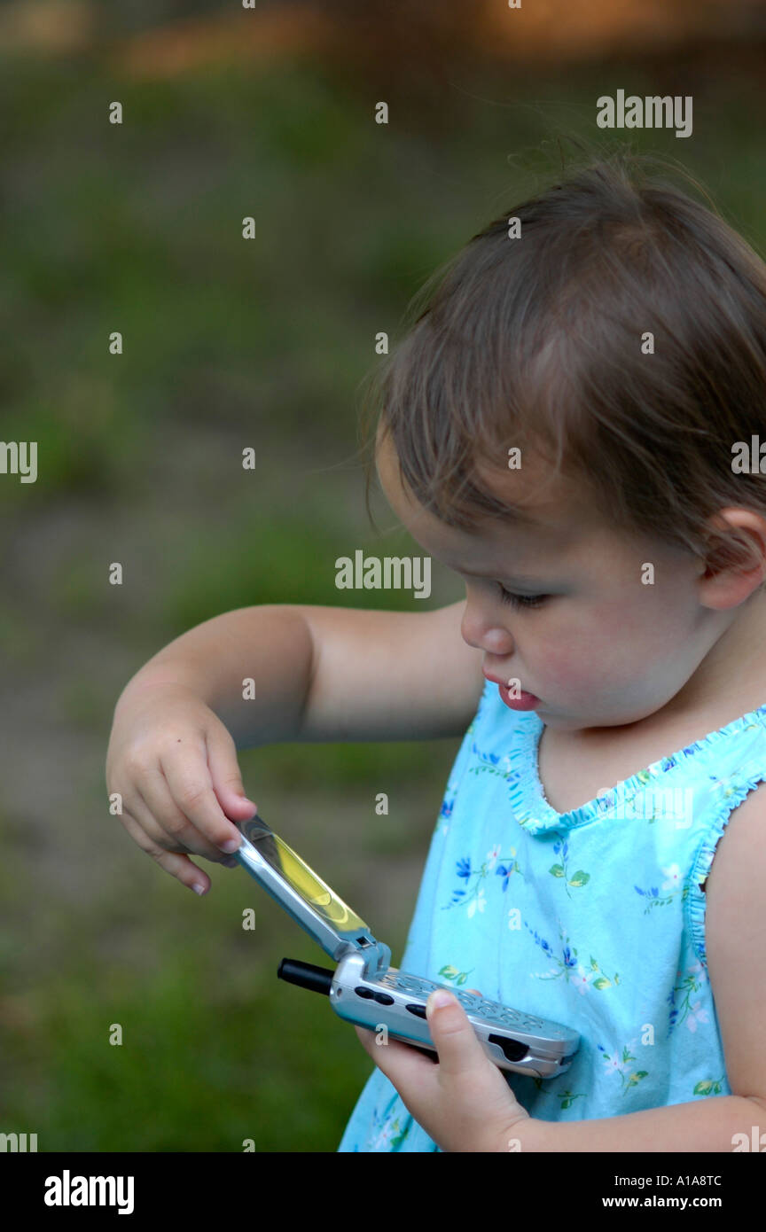Toddler using a cell phone Stock Photo - Alamy