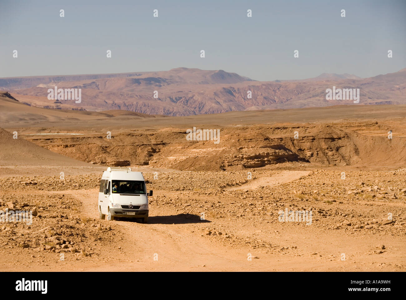 Chile Atacama desert tour bus on dirt road Stock Photo - Alamy