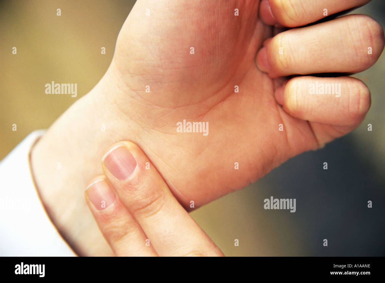 Taking a pulse Stock Photo - Alamy