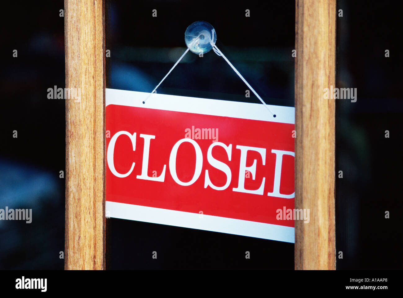 Closed sign in a shop window Stock Photo - Alamy