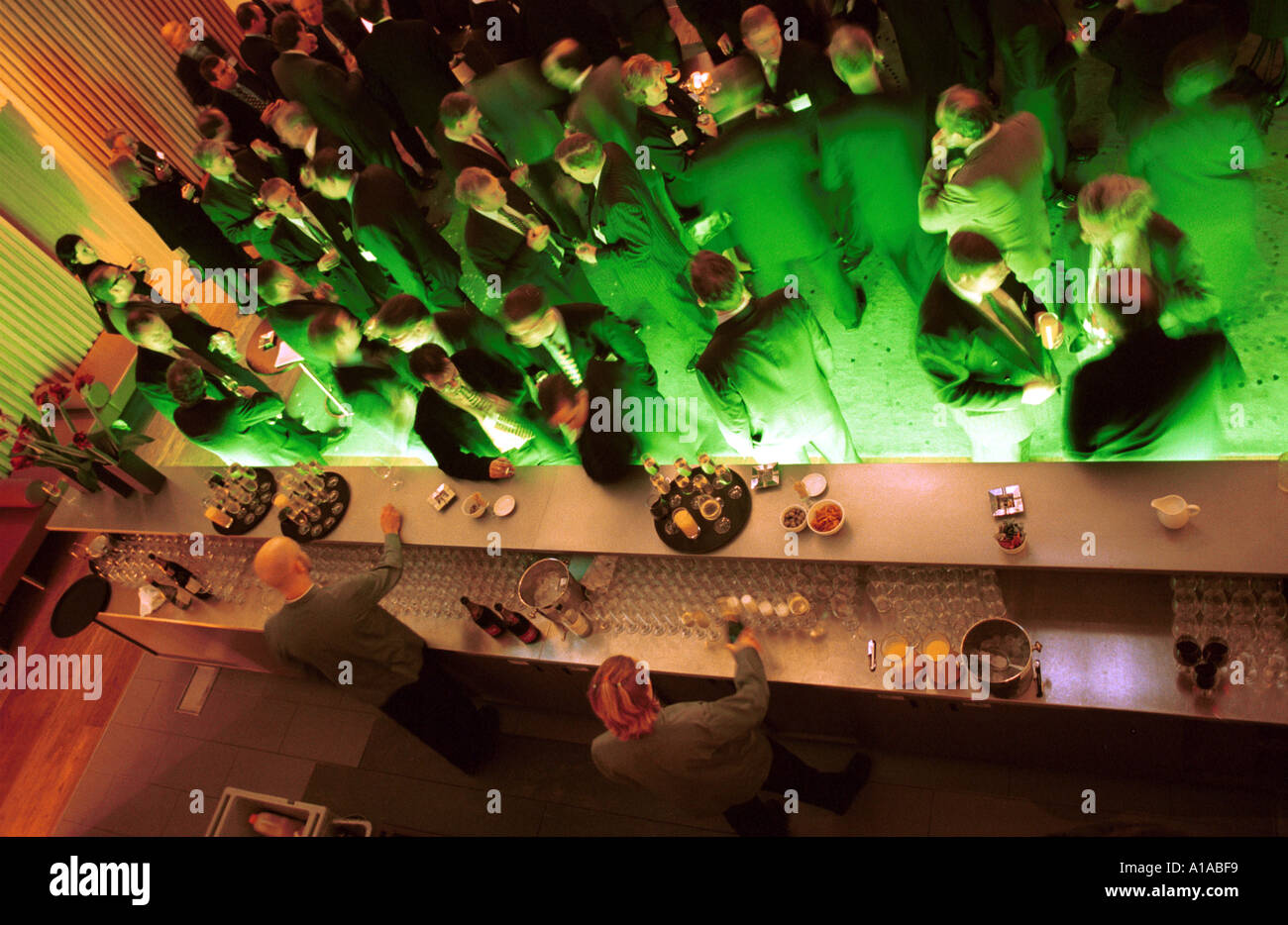 Business people mingle in a bar Stock Photo - Alamy