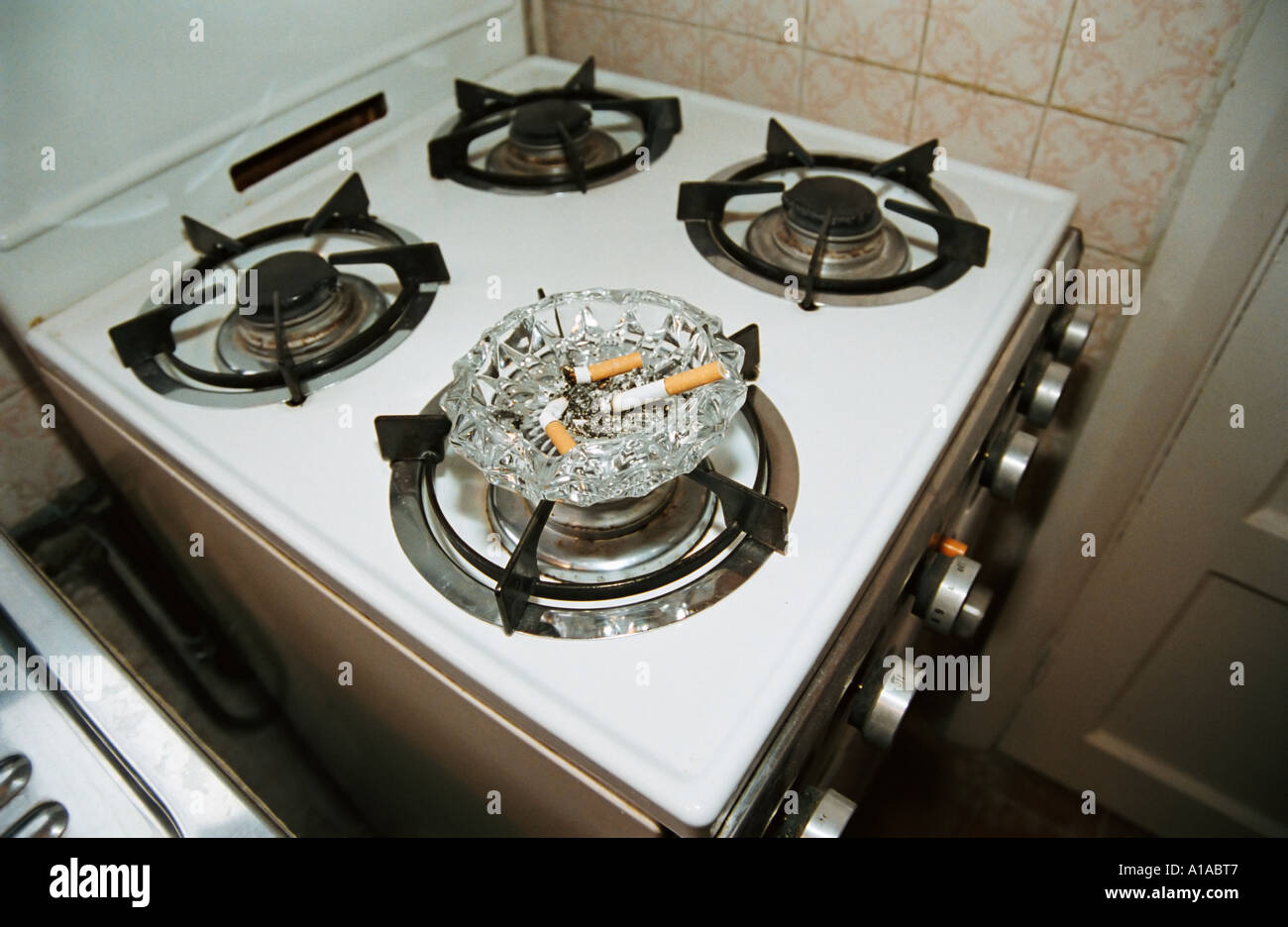Ashtray on oven hob Stock Photo - Alamy