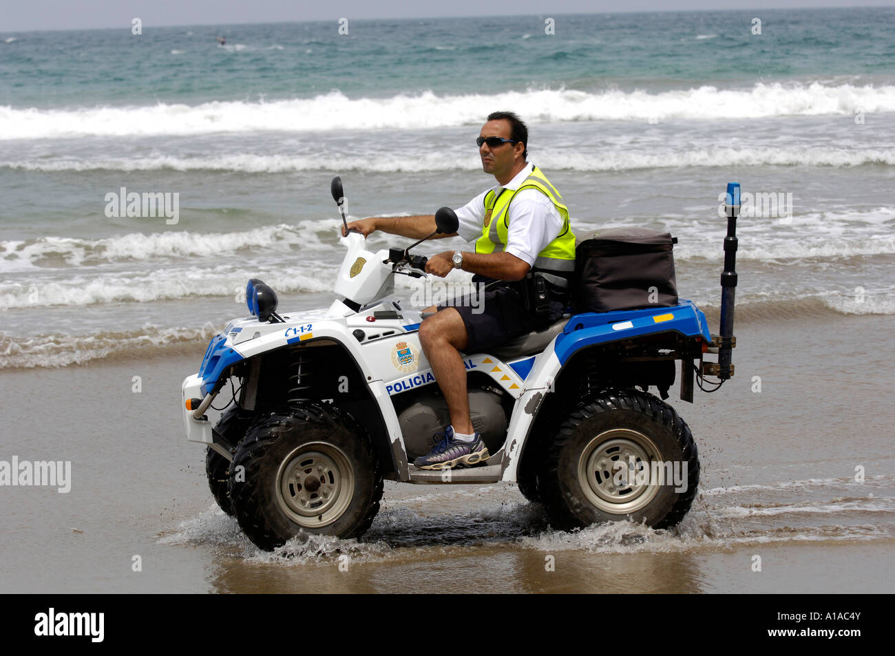 Police officers on beach buggy hi-res stock photography and images - Alamy