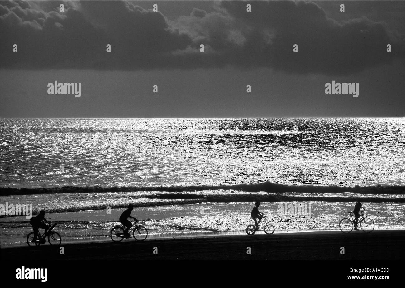 Beach scene with bicycles, Bali 2 Stock Photo - Alamy