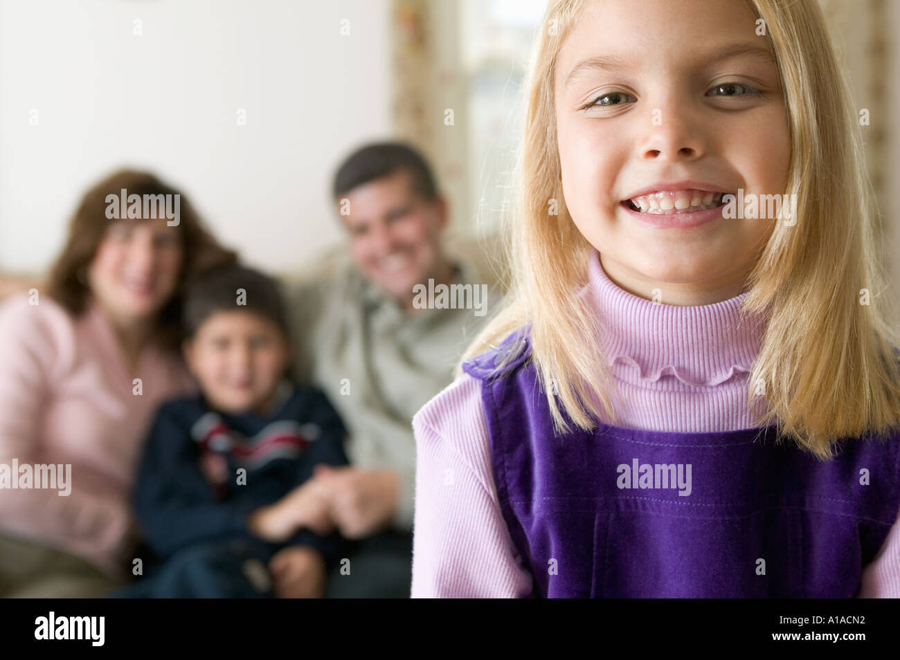 Girl and her family Stock Photo - Alamy