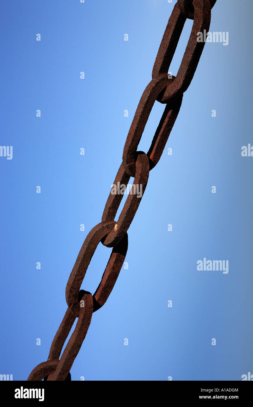 Rusty iron chain with blue sky Stock Photo - Alamy