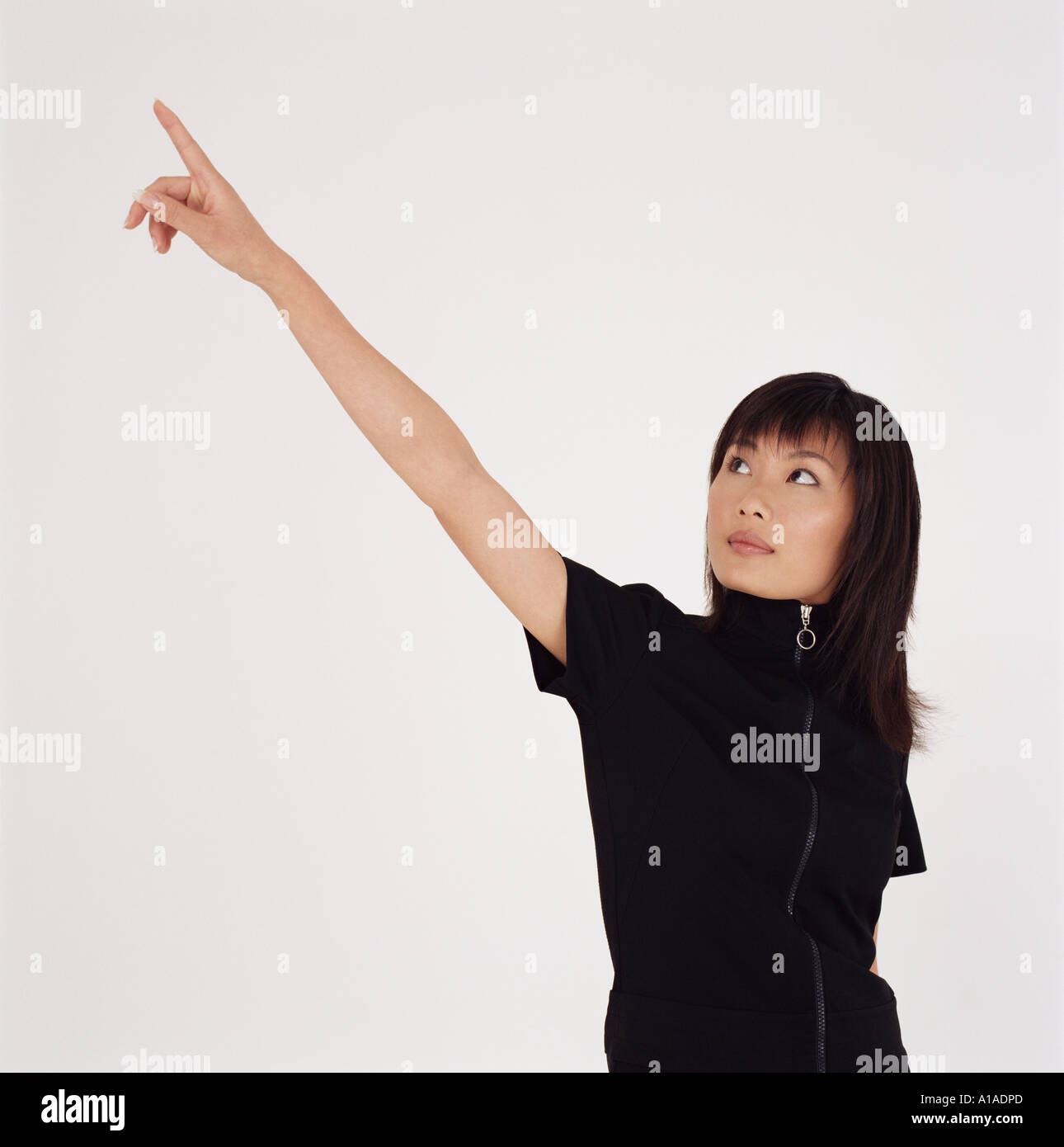 Asian Woman Pointing Upwards High Resolution Stock Photography and ...