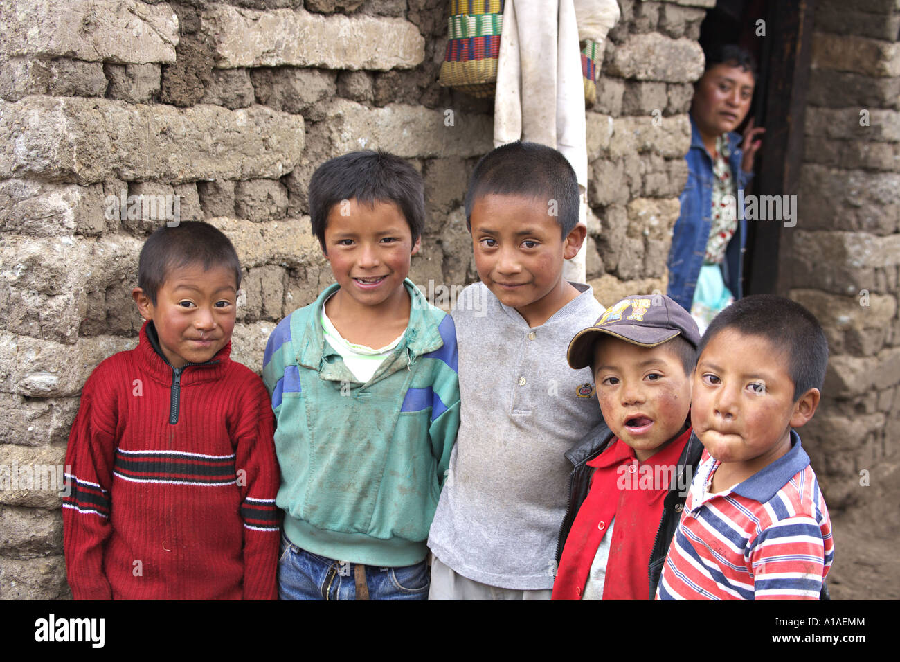 GUATEMALA CAPELLANIA Indigenous Maya Quiche brothers standing outside ...