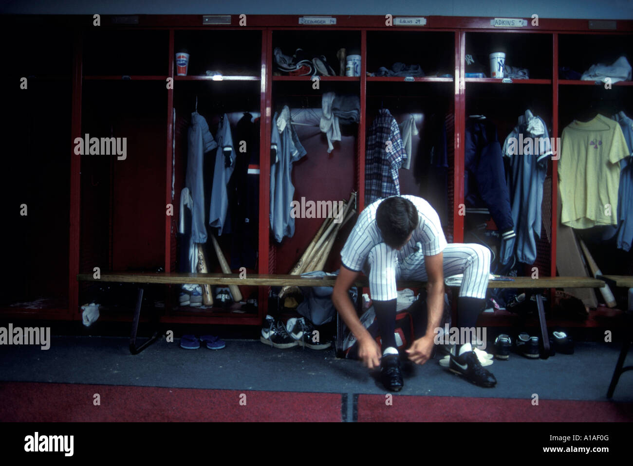 USA Virginia Prince William Yankees baseball player dresses in locker ...
