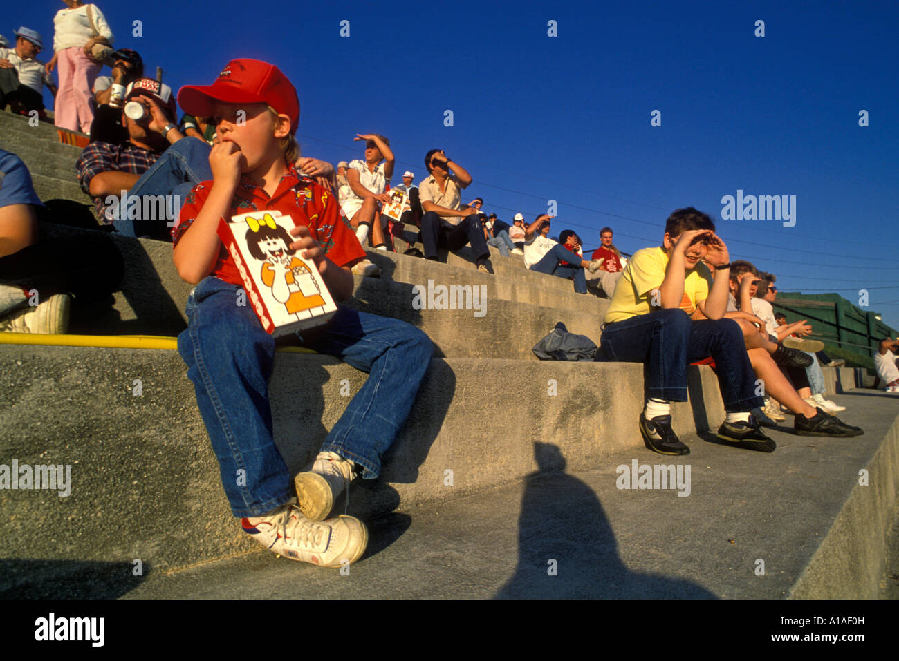 USA Virginia Salem Young fan eats popcorn while watching Salem Bucs ...