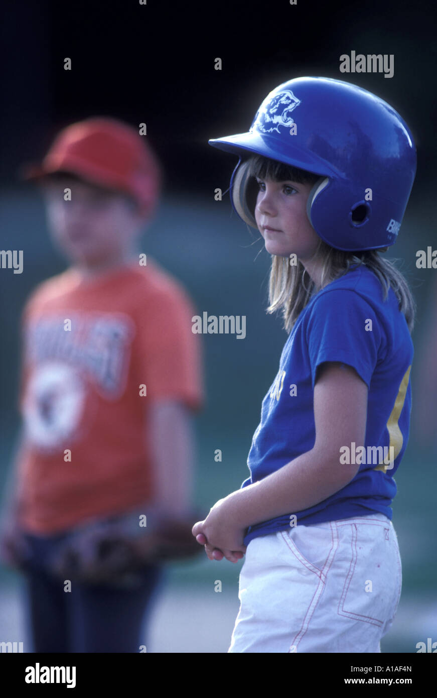 USA Maryland Laurel Young girl stands on base during at Little League ...