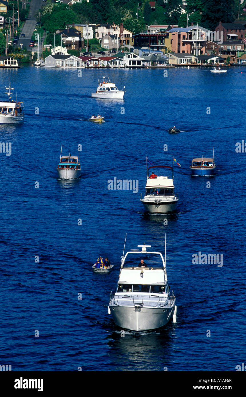 Washington Seattle Sunrise lights line of power boats sailing through ...