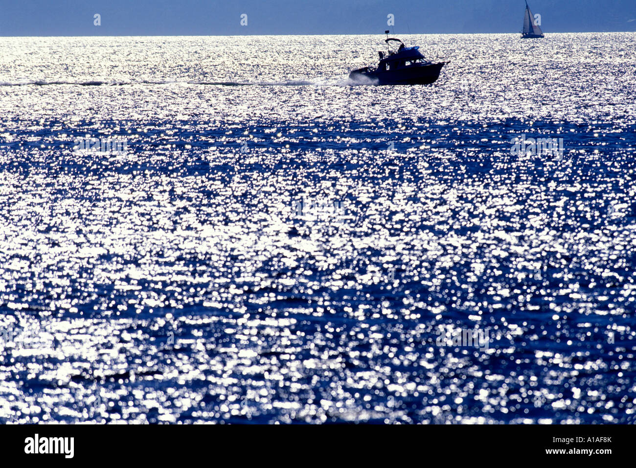 Washington Seattle Fishing boat motors through Elliot Bay on sunny ...