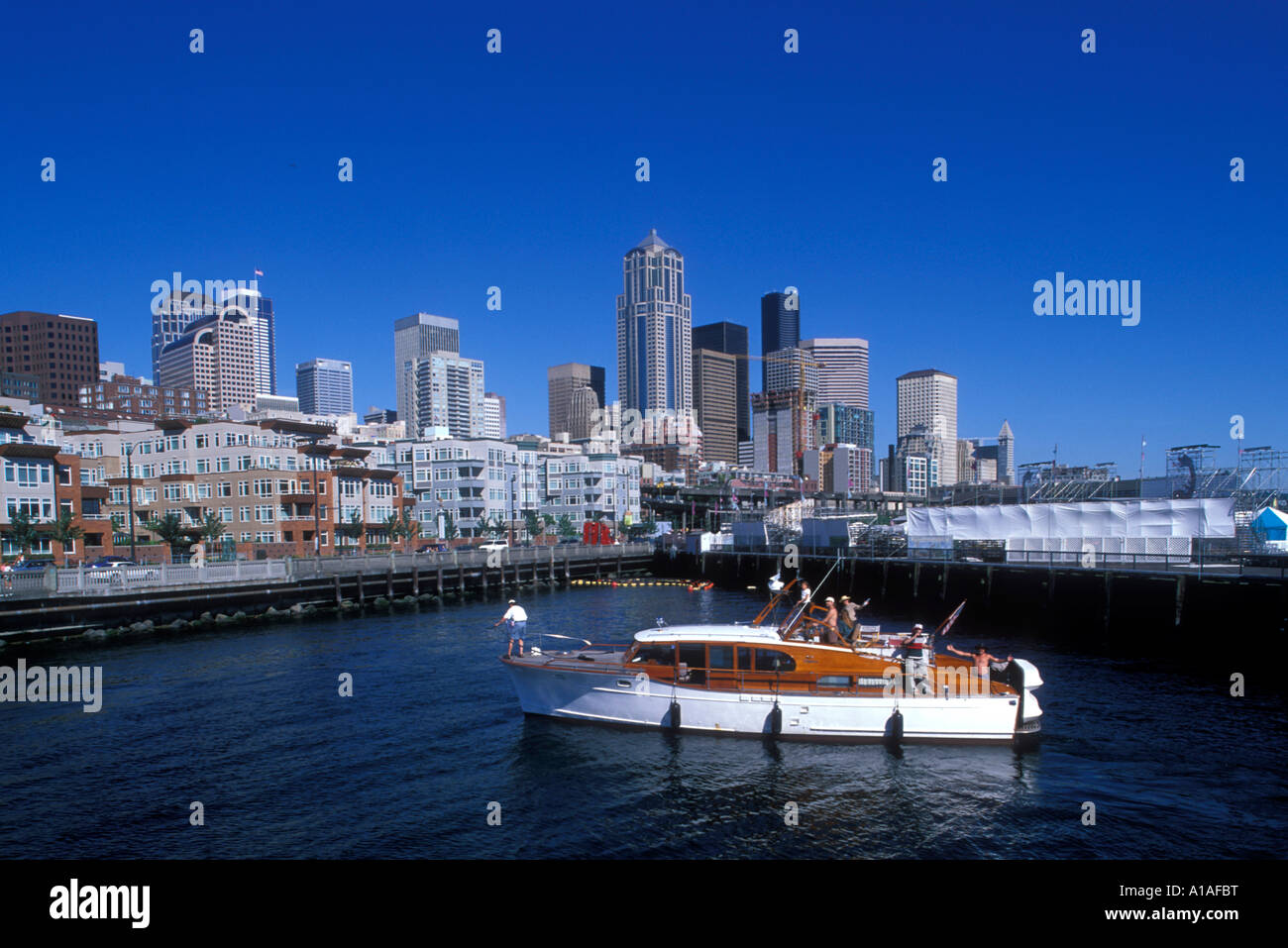USA, Washington, Seattle, Classic wooden yacht motors into downtown ...