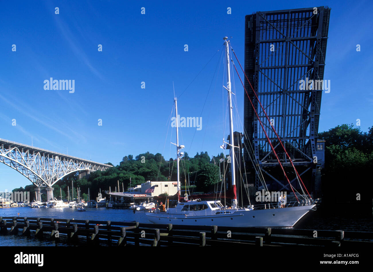 USA, Washington, Seattle, Yacht motors under drawbridge in city's ...