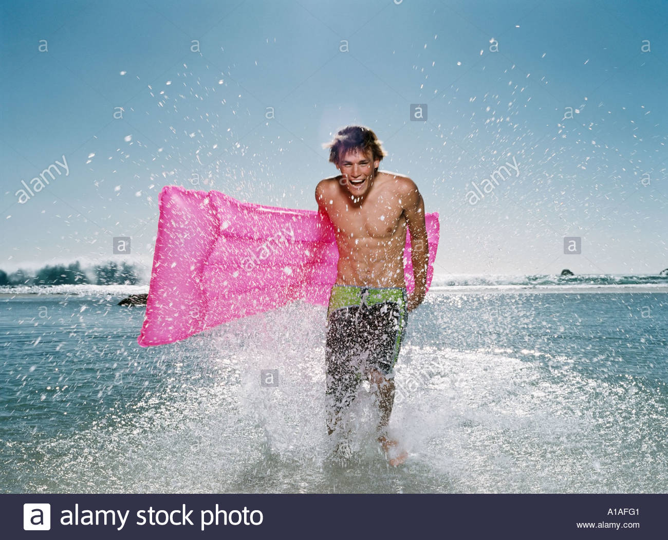 Young Man In Swimming Trunks Stock Photos & Young Man In Swimming ...