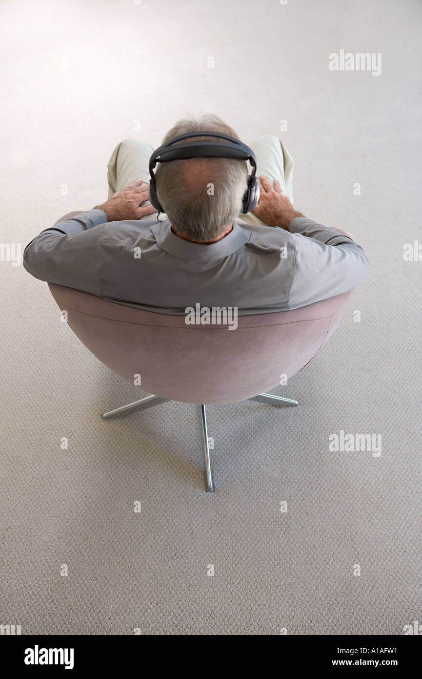 Rear view of man wearing headphones Stock Photo - Alamy