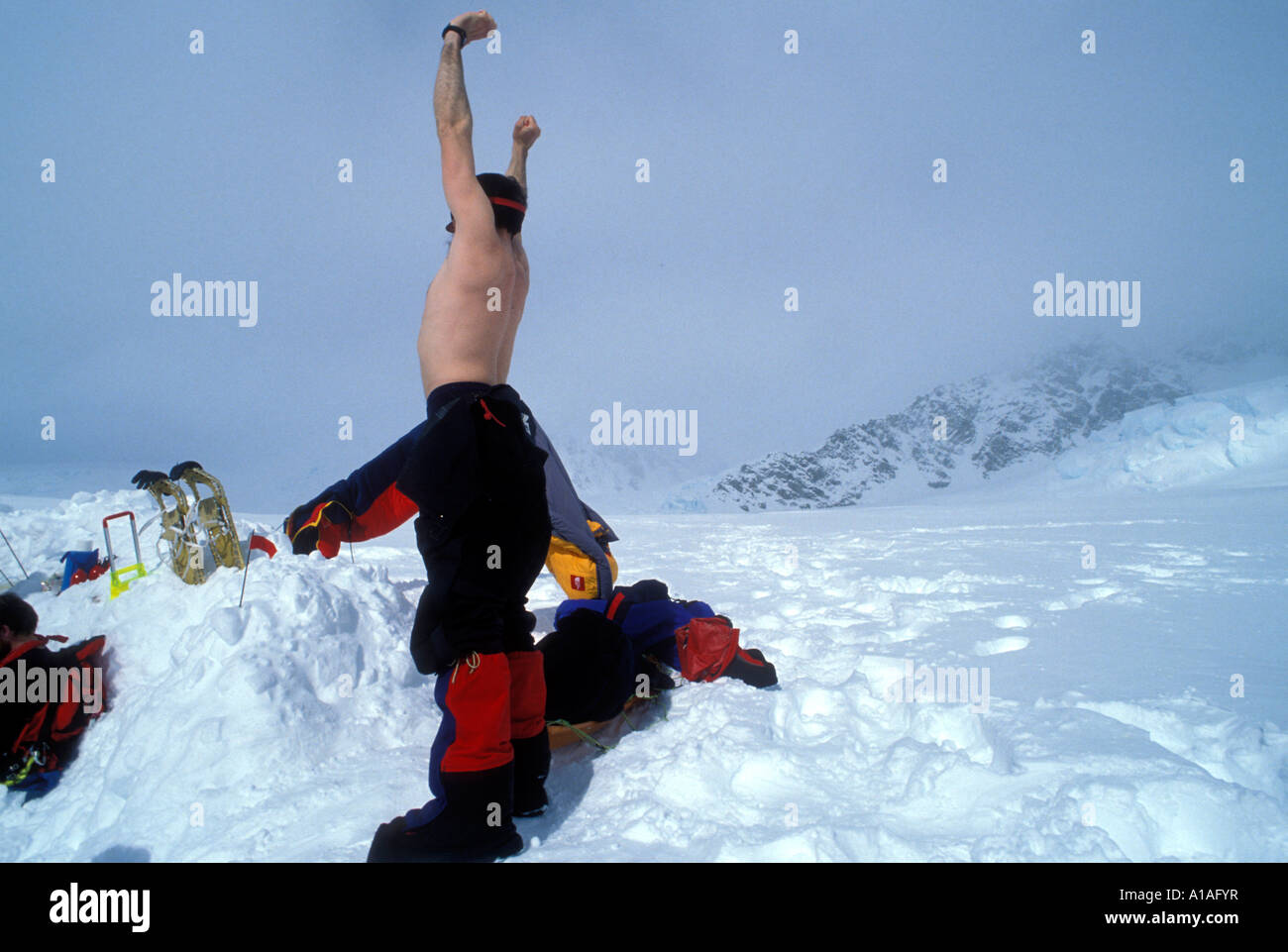 USA Alaska Denali National Park MR Rick Ford stretches in morning sun ...