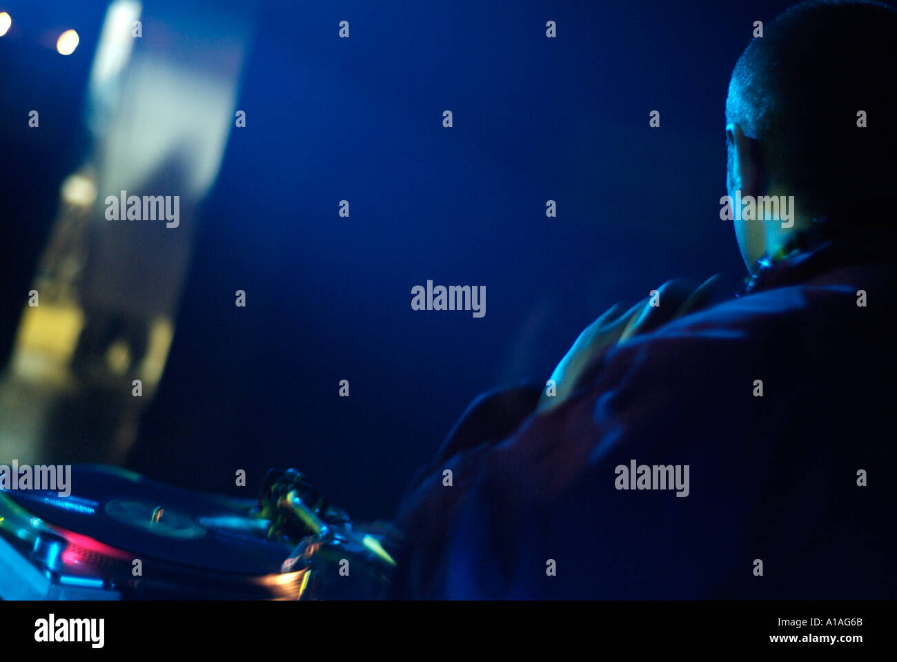 Dj behind decks hi-res stock photography and images - Alamy