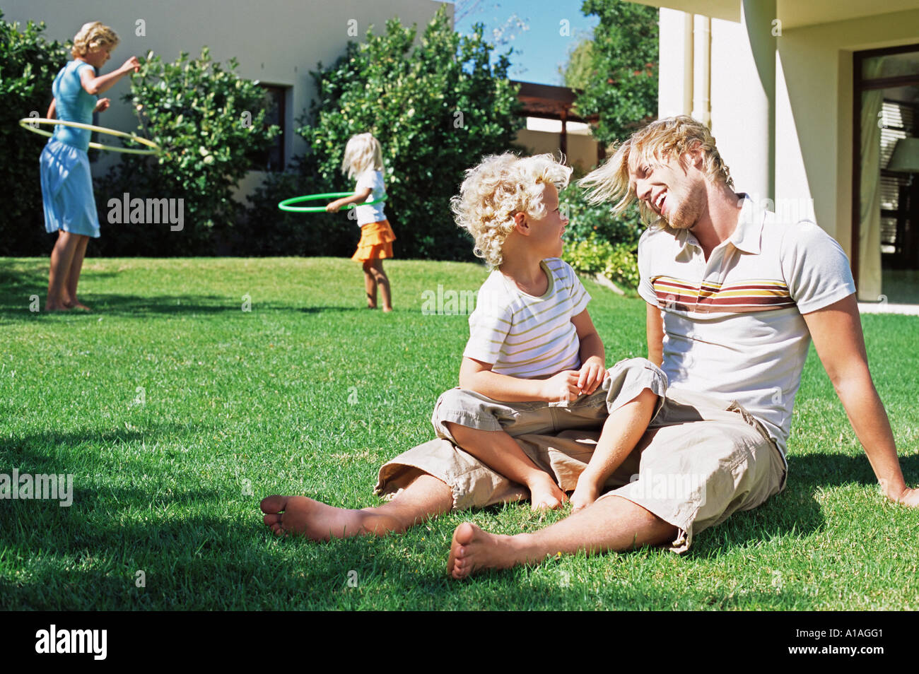 Family in garden Stock Photo - Alamy