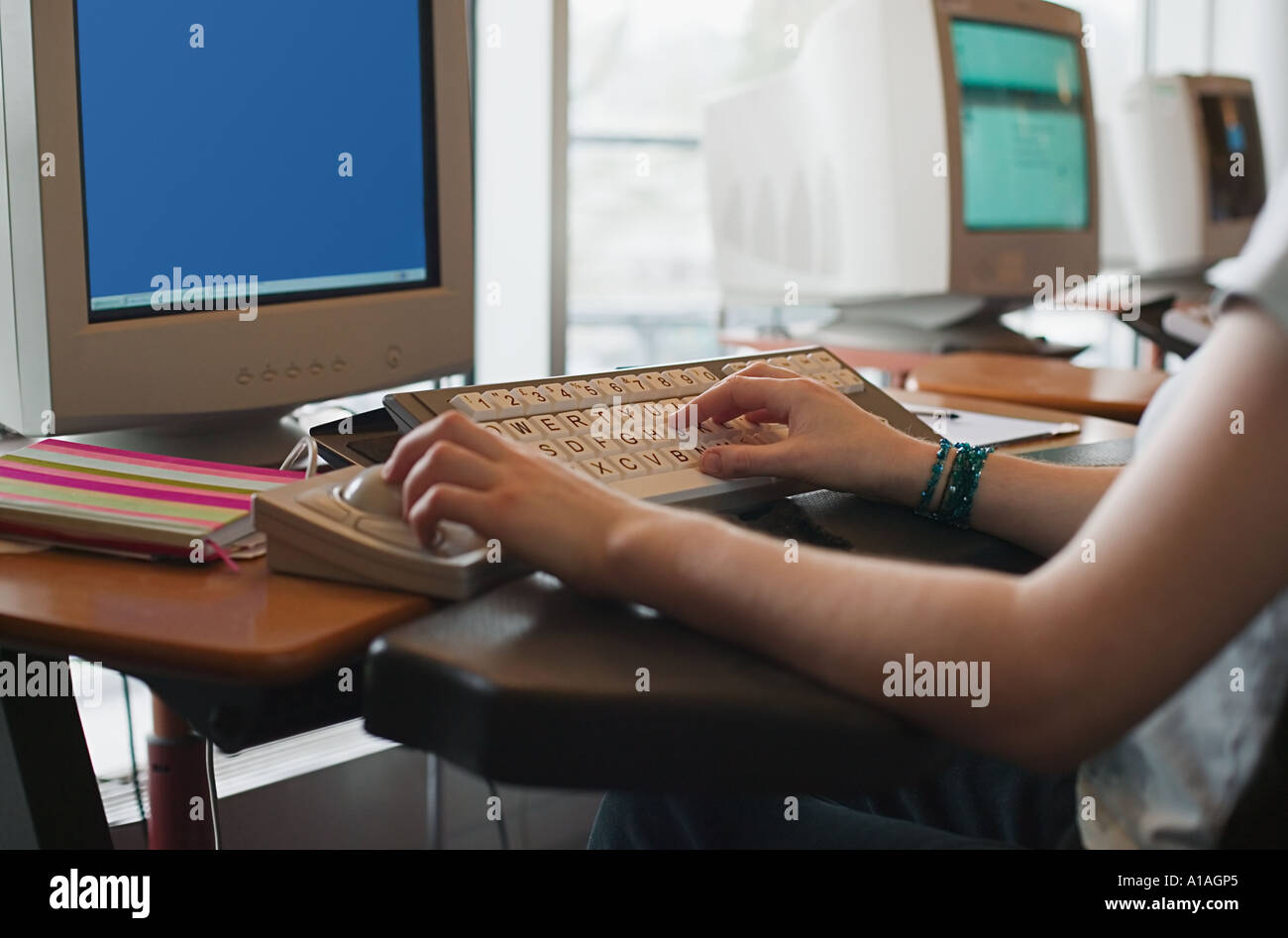 Someone using a specially adapted computer Stock Photo - Alamy