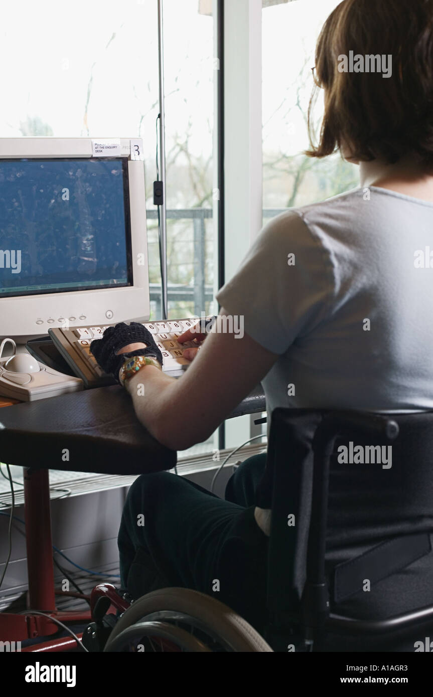 Disabled woman using a computer Stock Photo - Alamy