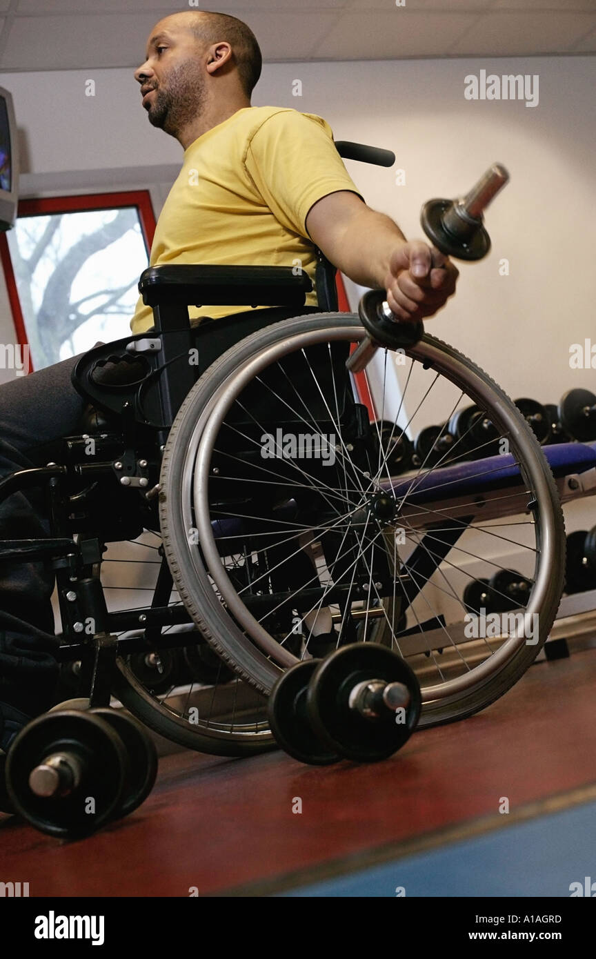Disabled man lifting weights Stock Photo - Alamy