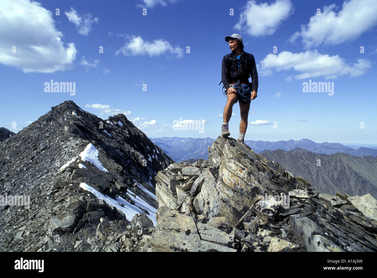 USA Alaska Arctic National Wildlife Refuge Hiker stands atop rocky ...