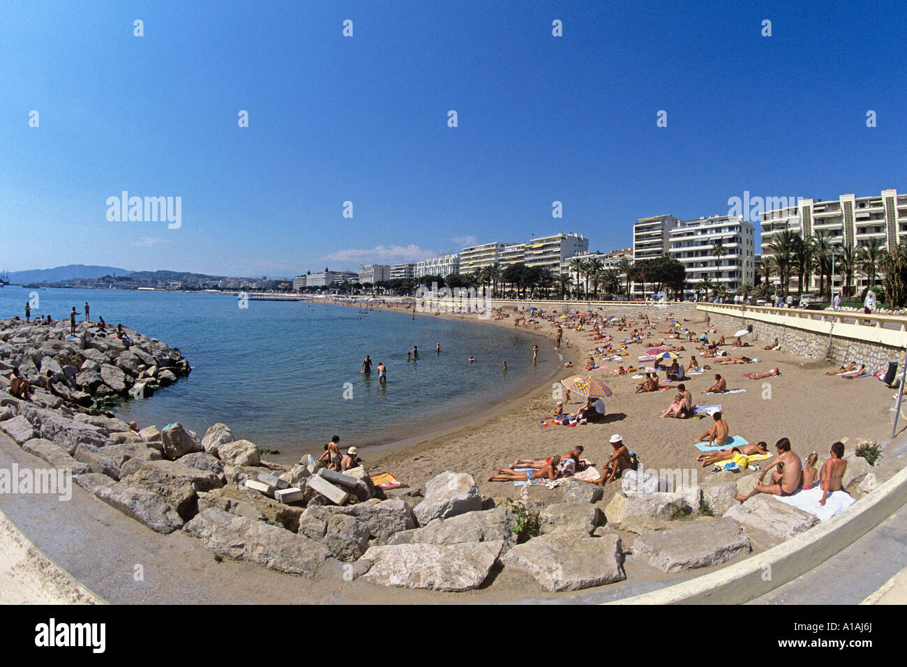 Beach and pomenade at the Eastern end of Cannes seafront Stock Photo ...