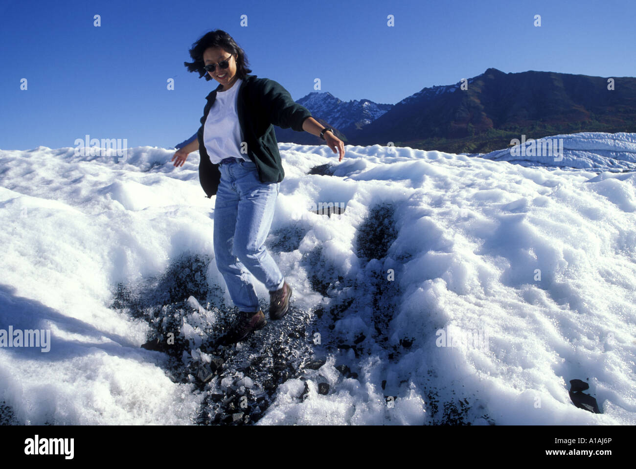 USA Alaska MR Helen Jung hikes on blue ice of Matanuska Glacier in ...