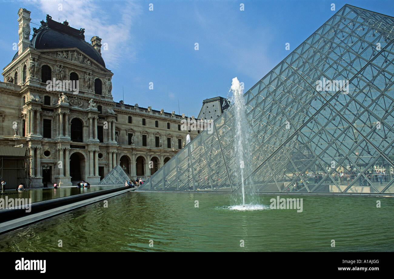 The Famous old Louvre Museum building with The glass Pyramid designed ...