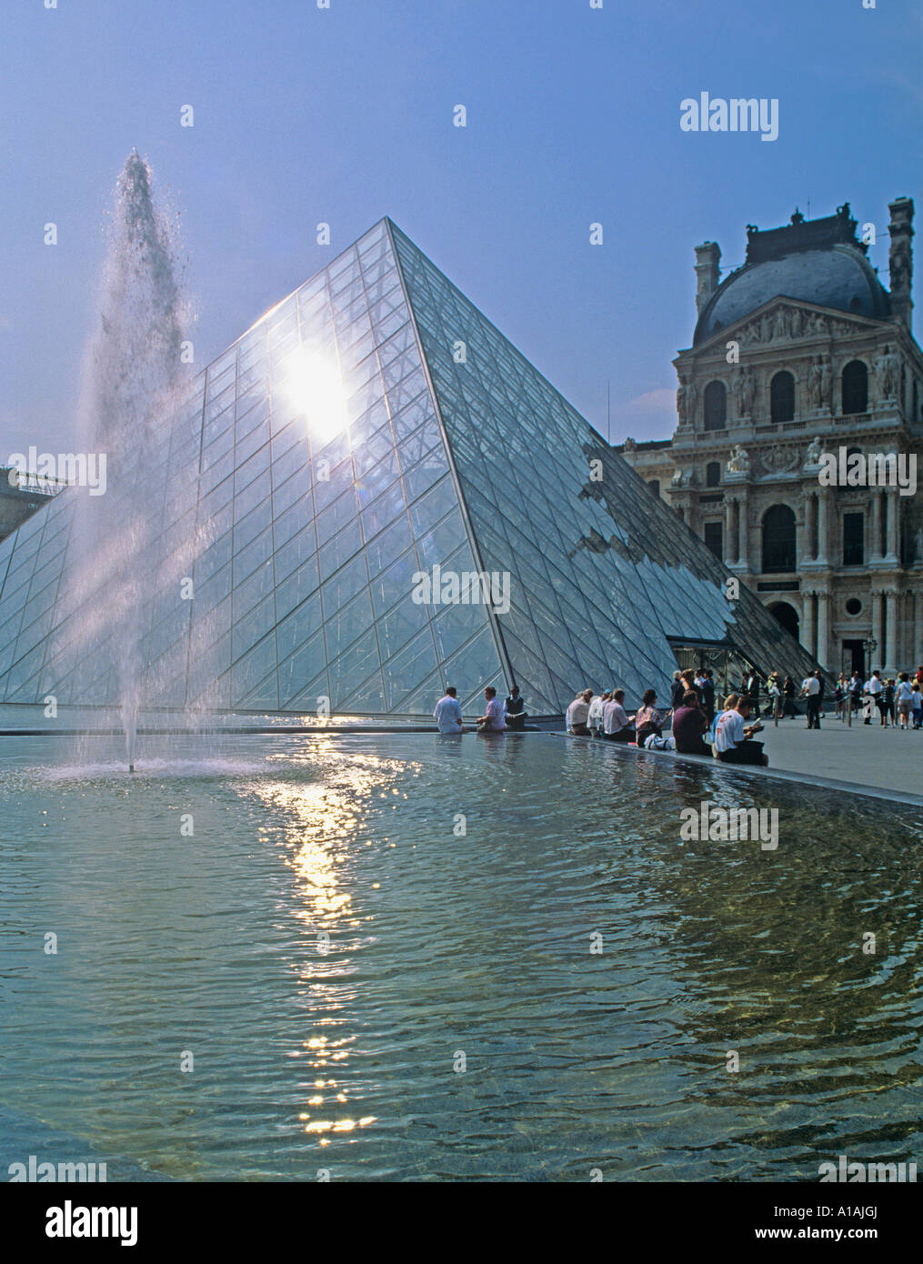 The Famous old Louvre Museum building with The glass Pyramid designed ...