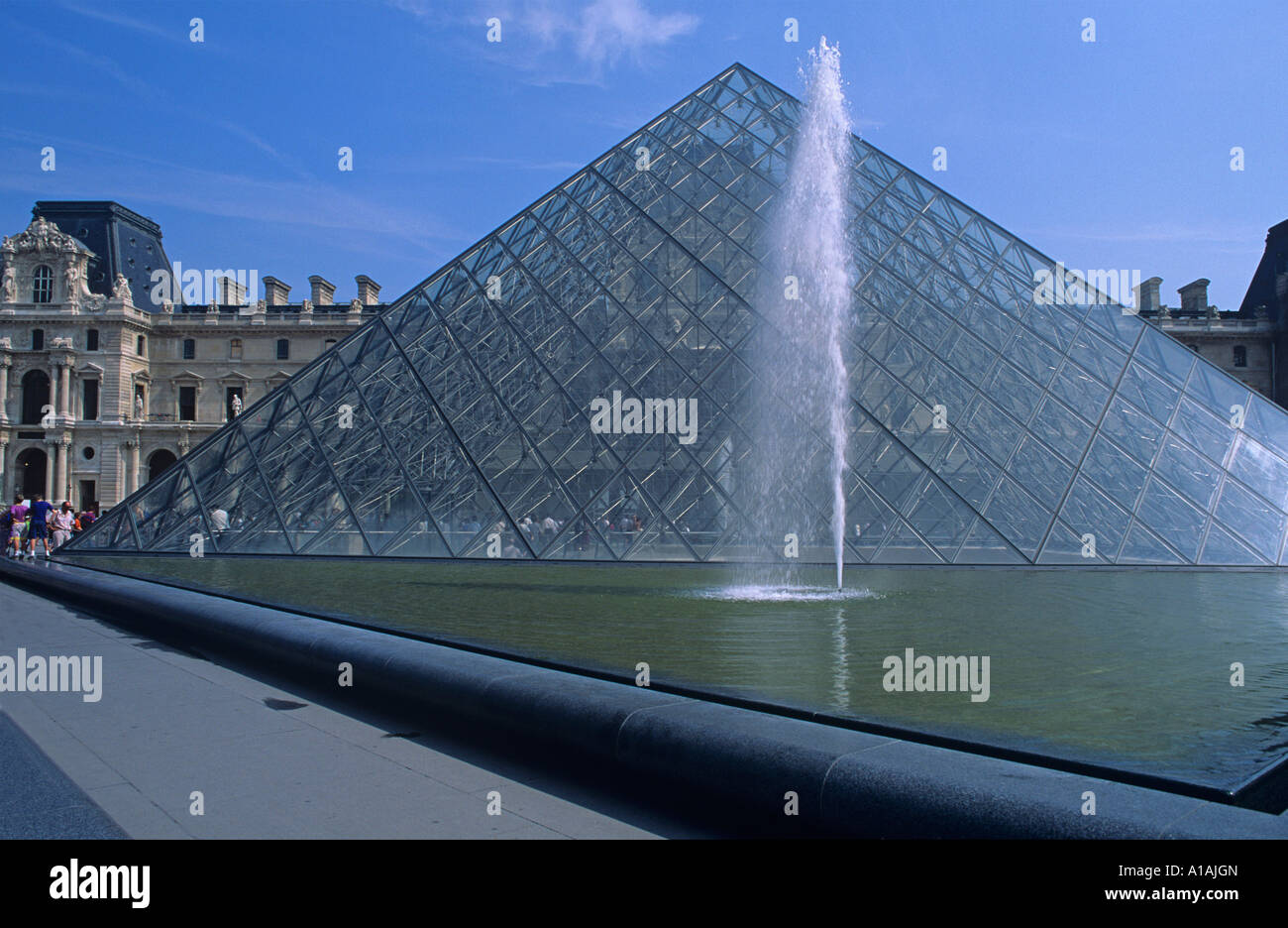 The Famous old Louvre Museum building with The glass Pyramid designed ...