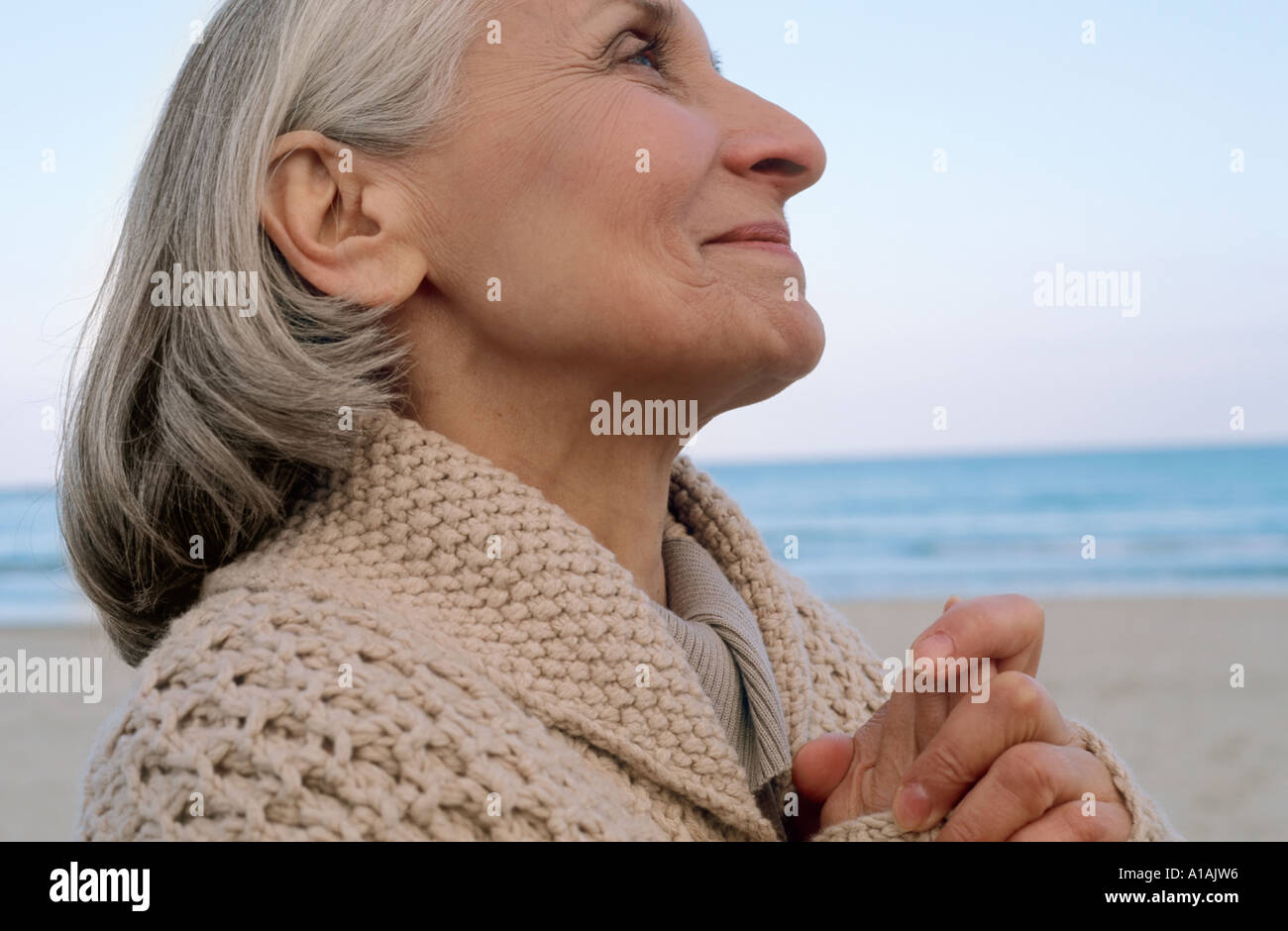 Senior woman looking spiritual Stock Photo - Alamy