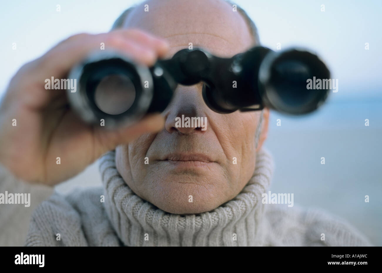 Old man holding binoculars hi-res stock photography and images - Alamy
