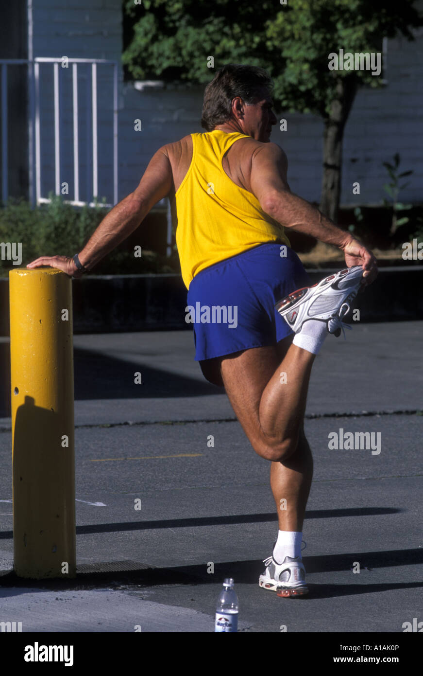 USA Washington Seattle Runner stretches before start of 5K Fun Run race ...