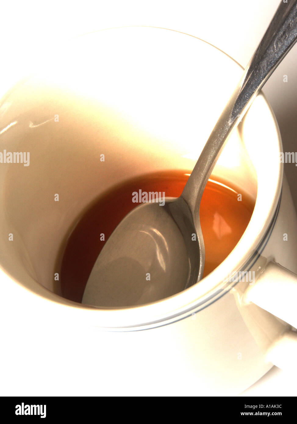 Coffee cup with spoon Stock Photo - Alamy