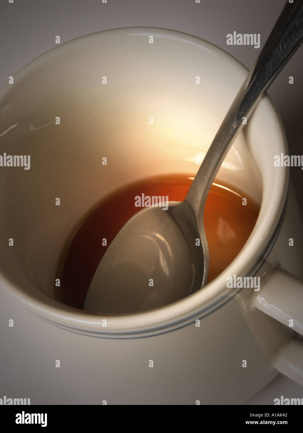 Coffee cup with spoon Stock Photo - Alamy