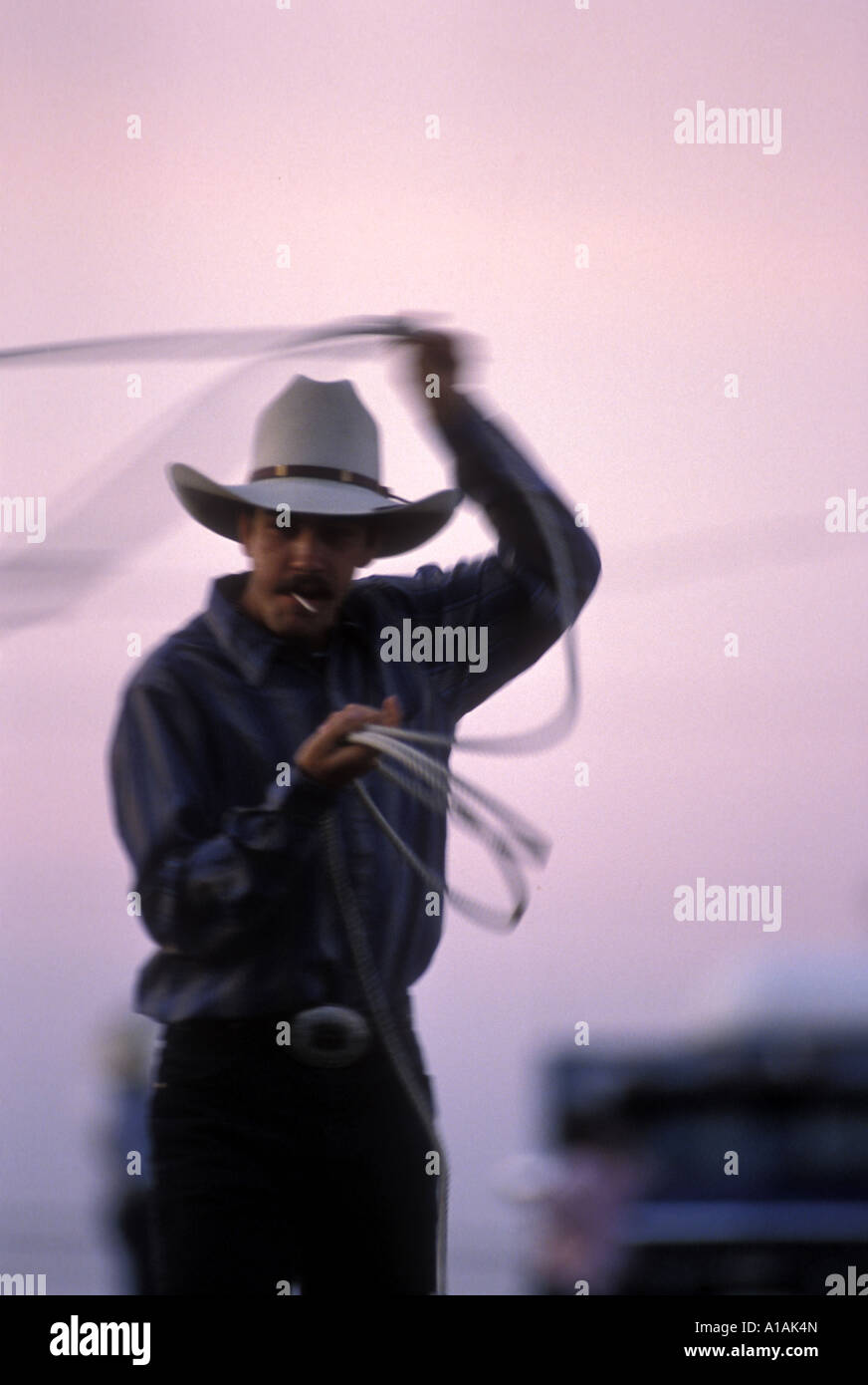 USA New Jersey Woodstown Rodeo cowboy practices with lasso before ...