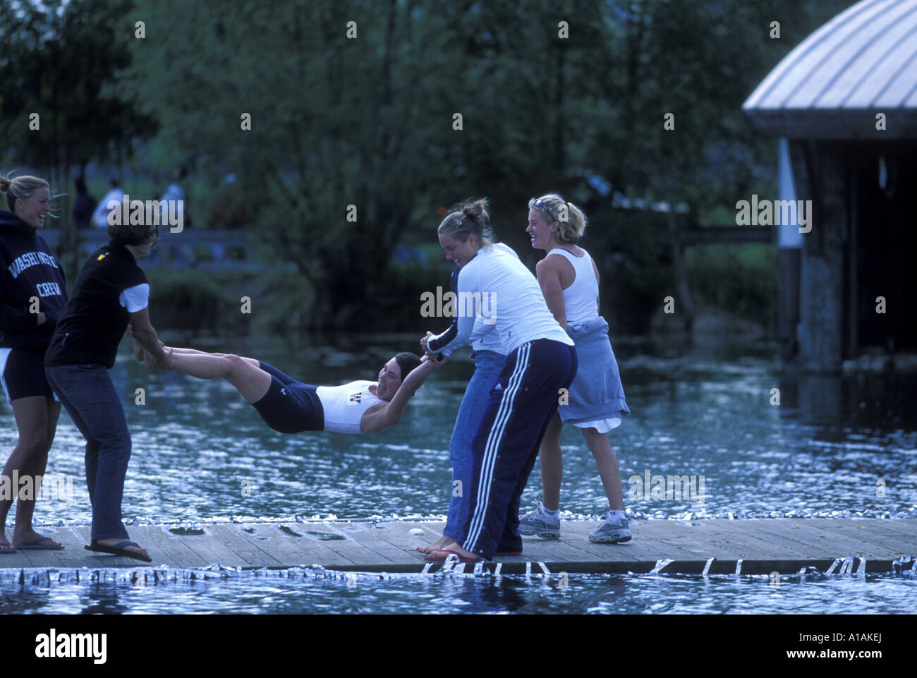 USA, Washington, Seattle, UW women's rowing team carries coxswain for ...