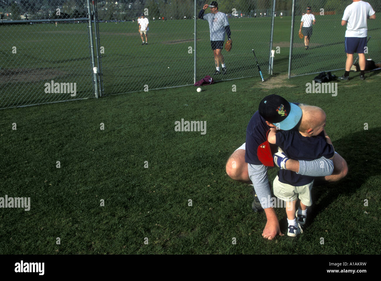 USA Washington Seattle Father plays with infant son during recreational ...