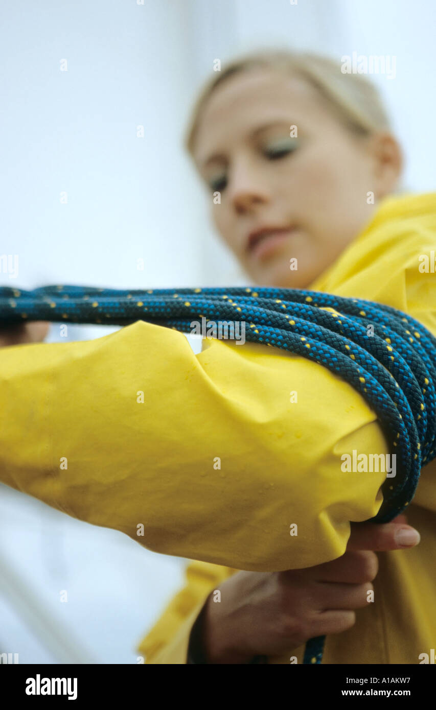 Woman winding rope around her arm Stock Photo - Alamy