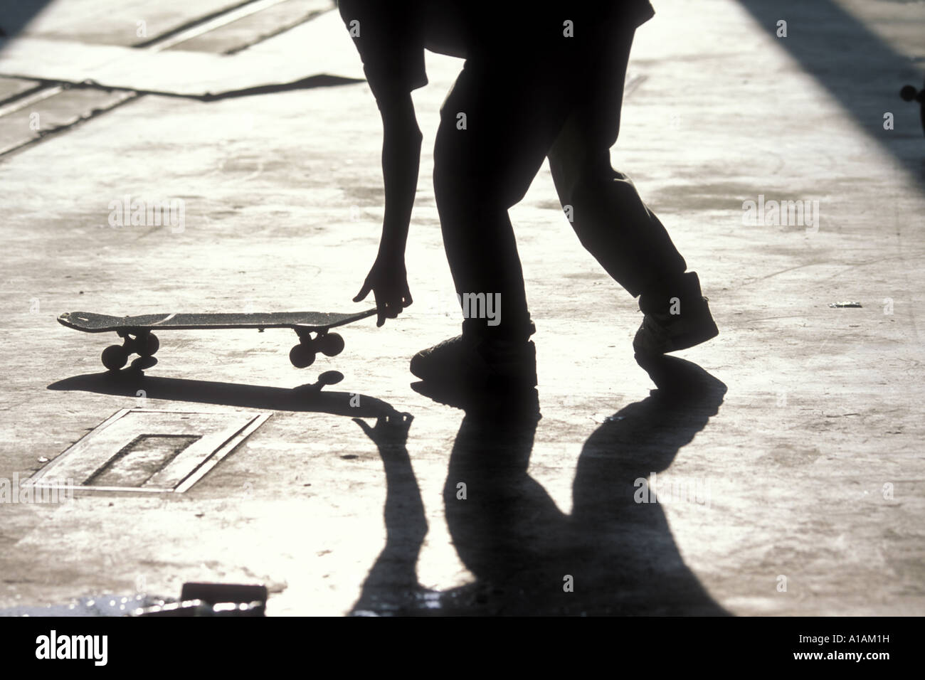 USA Washington Seattle Silhouette of skateboarder riding inside old ...