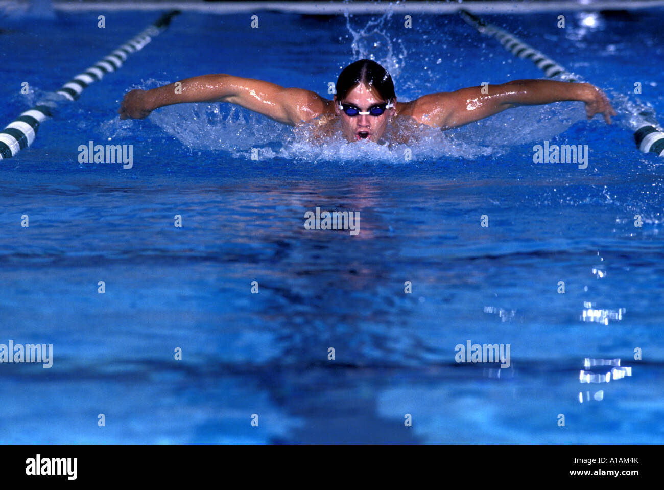USA Alaska Anchorage Ken Ralph swims in indoor pool during college ...