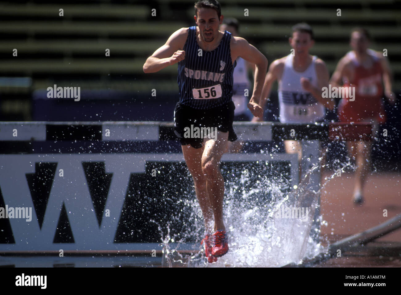 USA Washington Seattle Runners in 3K Steeplechase splash through water ...