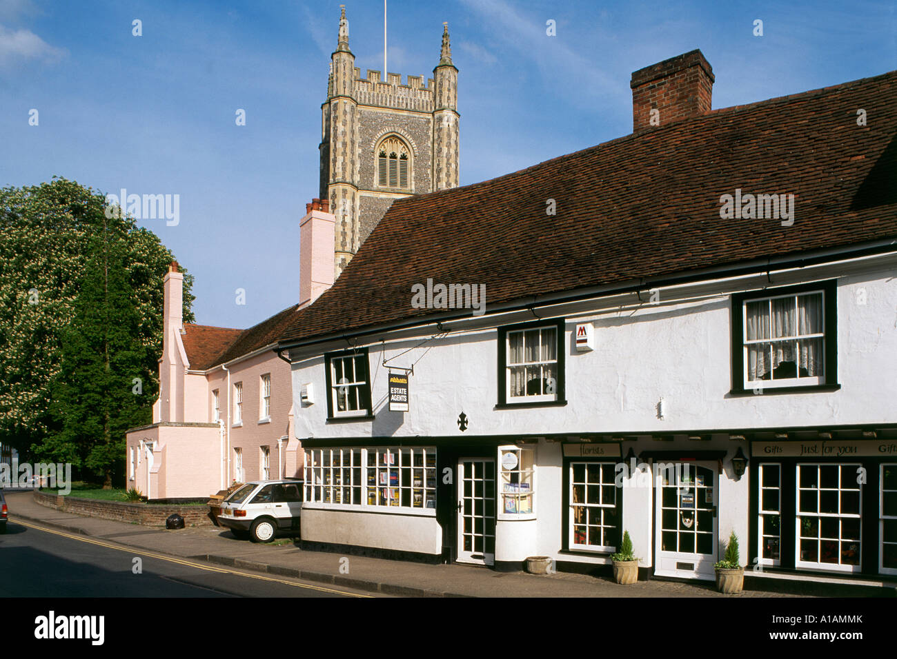 The tower of St Mary the Virgin s Church overlooking shops on the High ...