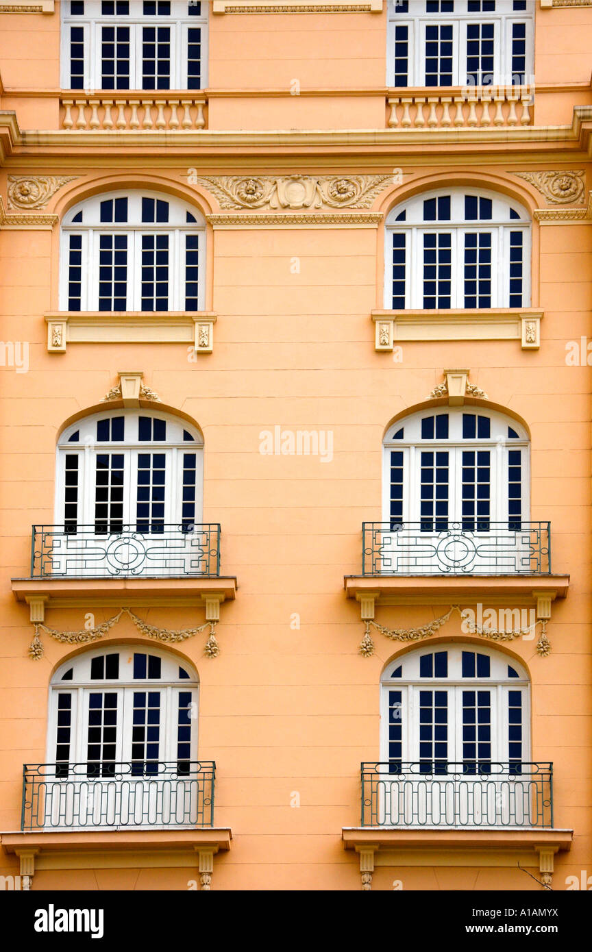 A building of colonial architecture with windows and balconies in ...