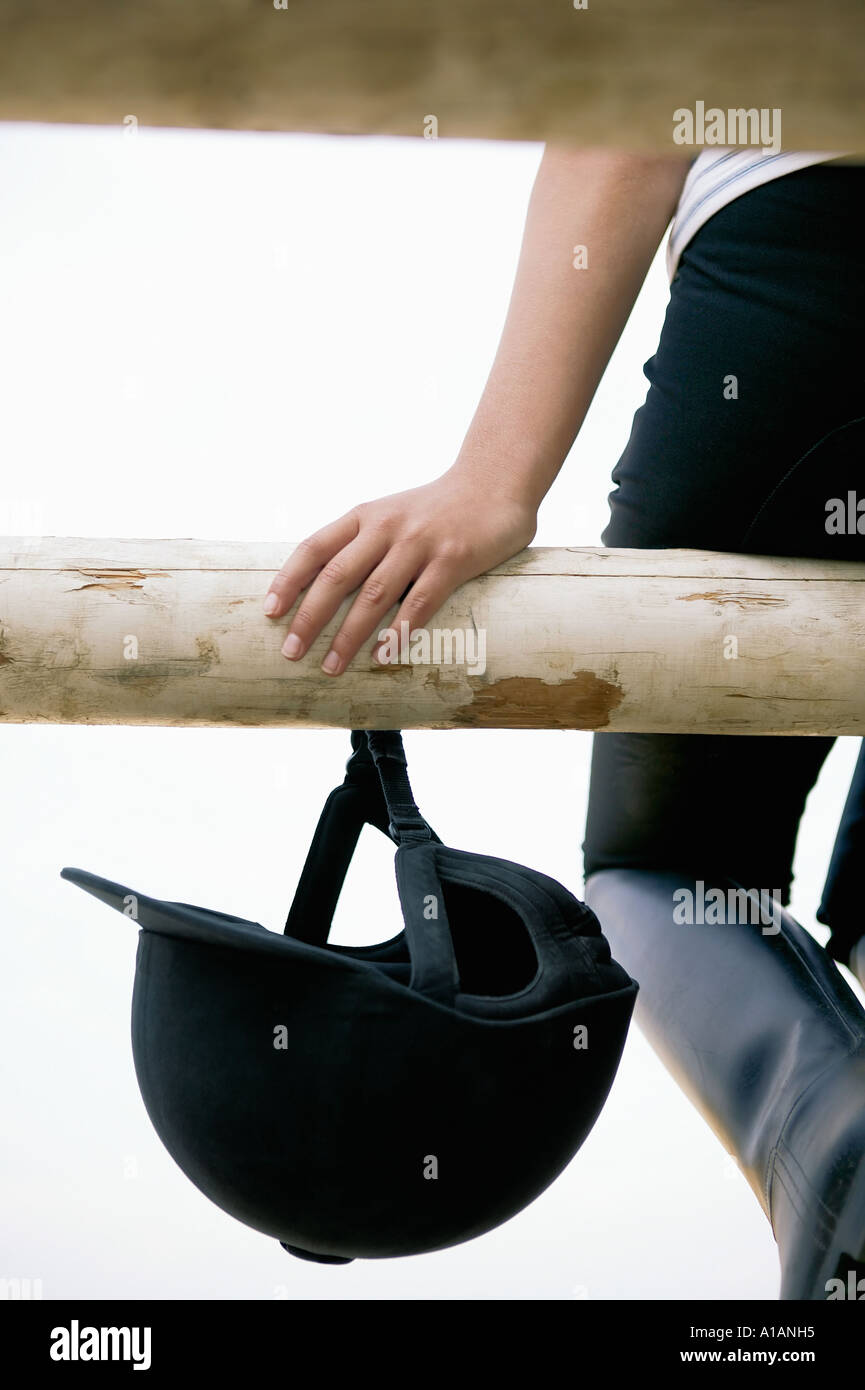 Person holding a riding hat Stock Photo - Alamy