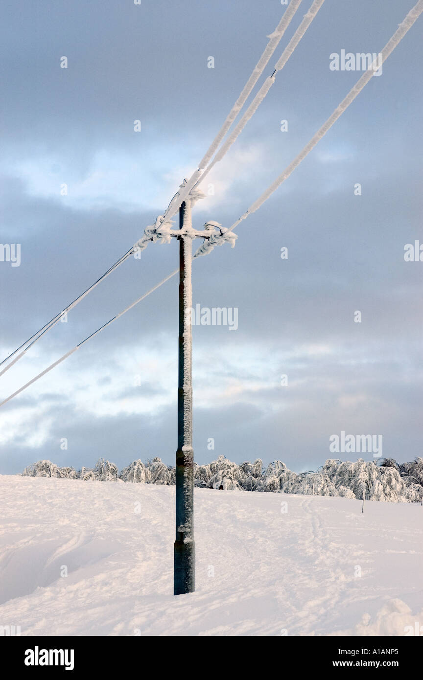 Electricity Pylons and wires covered with snow Stock Photo - Alamy