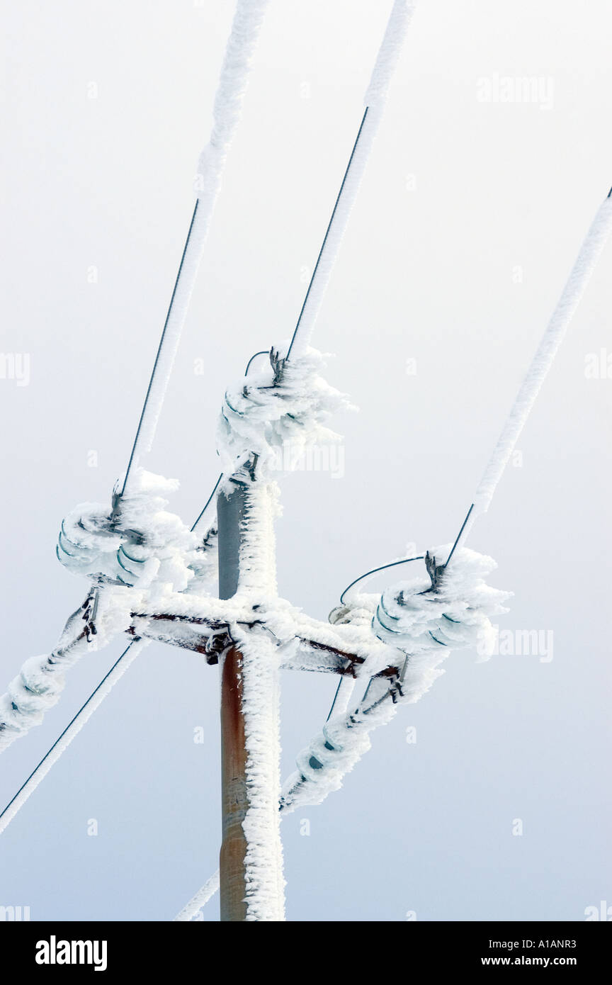 Electricity Pylons and wires covered with snow Stock Photo - Alamy